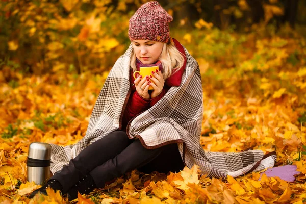 Autumn woman drinking coffee. Fall concept of young woman enjoying hot ...