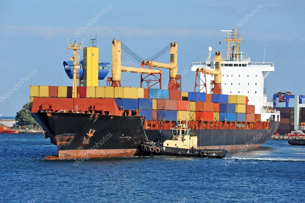 Tugboat assisting container cargo ship Stock Photo by ©unkas 33245383