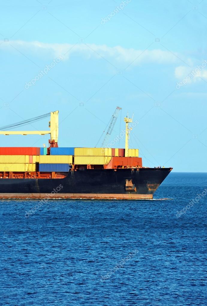 Tugboat assisting container cargo ship Stock Photo by ©unkas 33608405