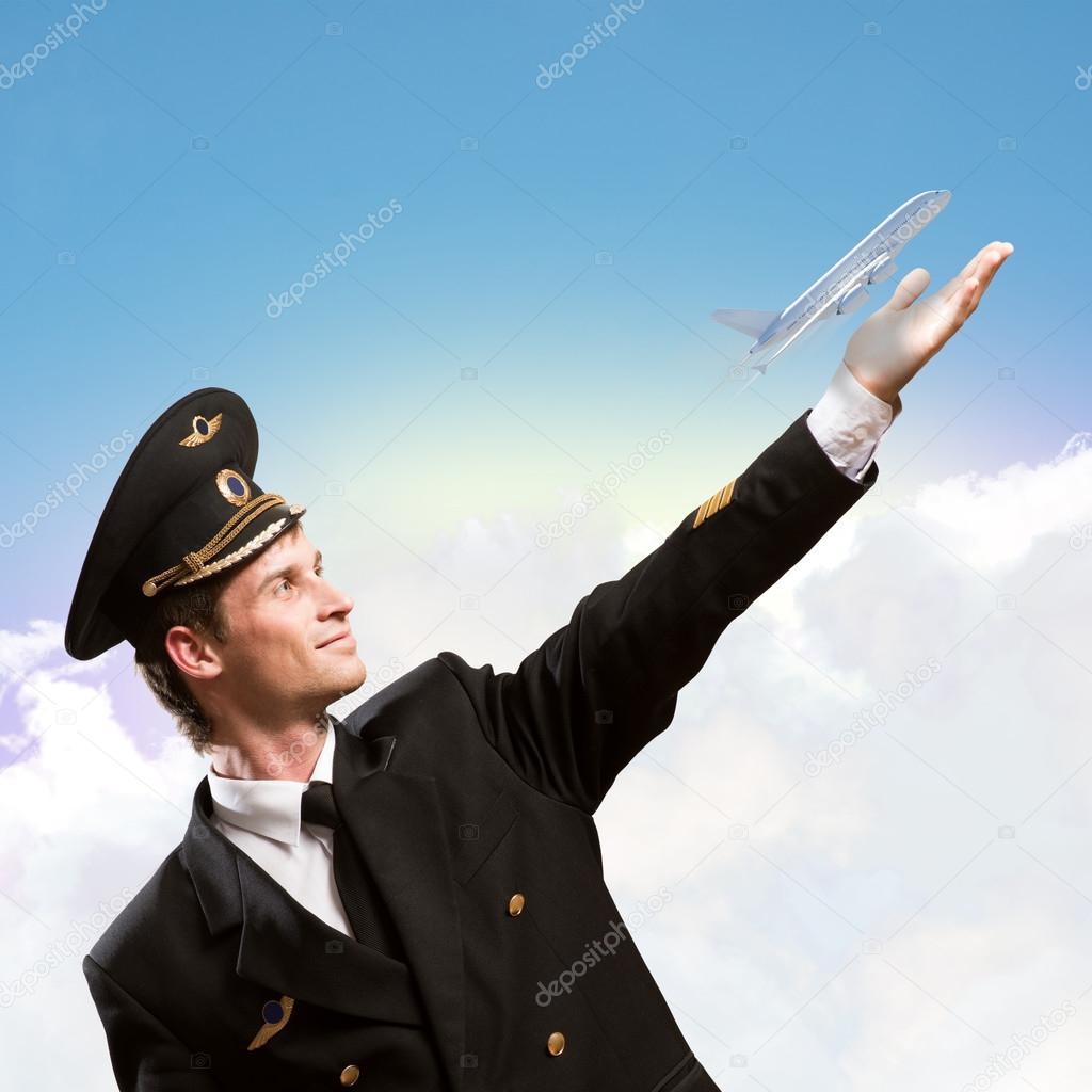 Pilot in the form of extending a hand to airplane Stock Photo by ...