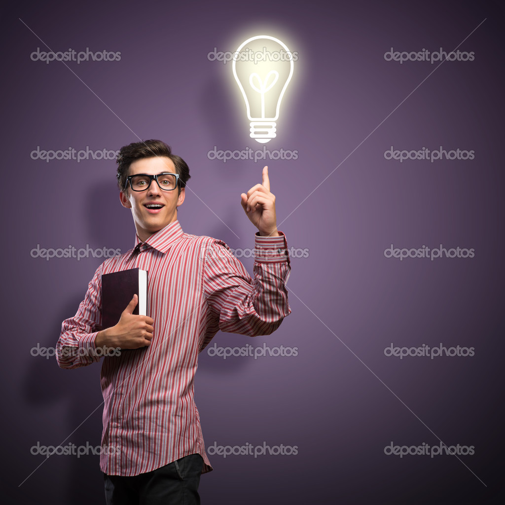 Photo: guy holding book | Young man holding a book — Stock Photo ...