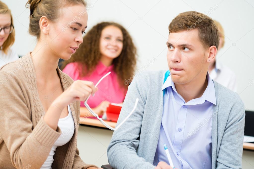 Two Students Talking In Class