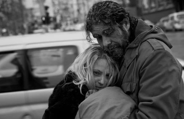 Homeless couple struggle city centre — Stock Photo © vilevi #9217368