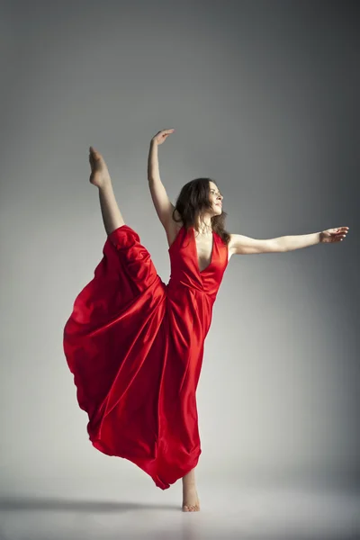 Ballet dancer wearing red dress over grey — Stock Photo © Julenochek ...