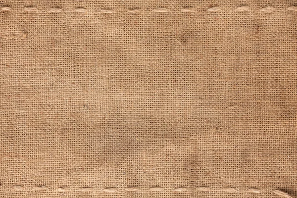 The two horizontal stitching on the burlap - Stock Image - Everypixel