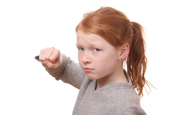 Cute angry girl pointing up Stock Photo by ©georgemuresan 73109073