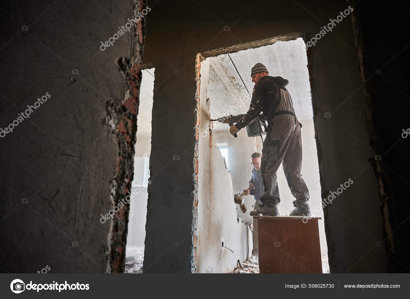 Bottom View Two Builders Deconstructing Interior Partition One Worker ...