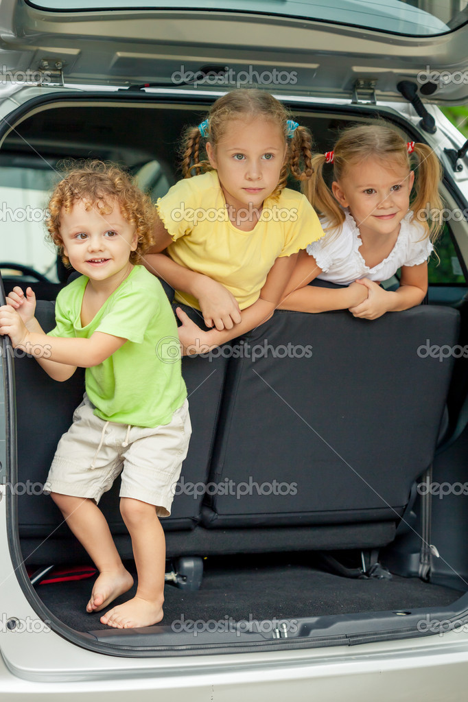 Three happy kids in the car Stock Photo by ©altanaka 30479283