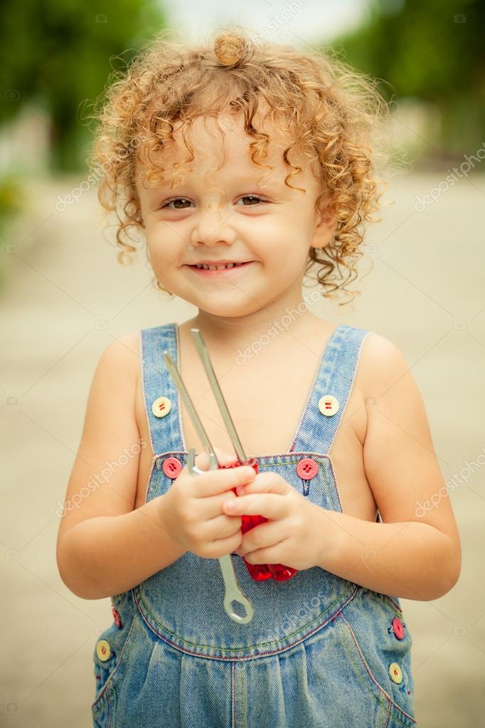 Little boy with a tool in the hands of Stock Photo by ©altanaka 30891257