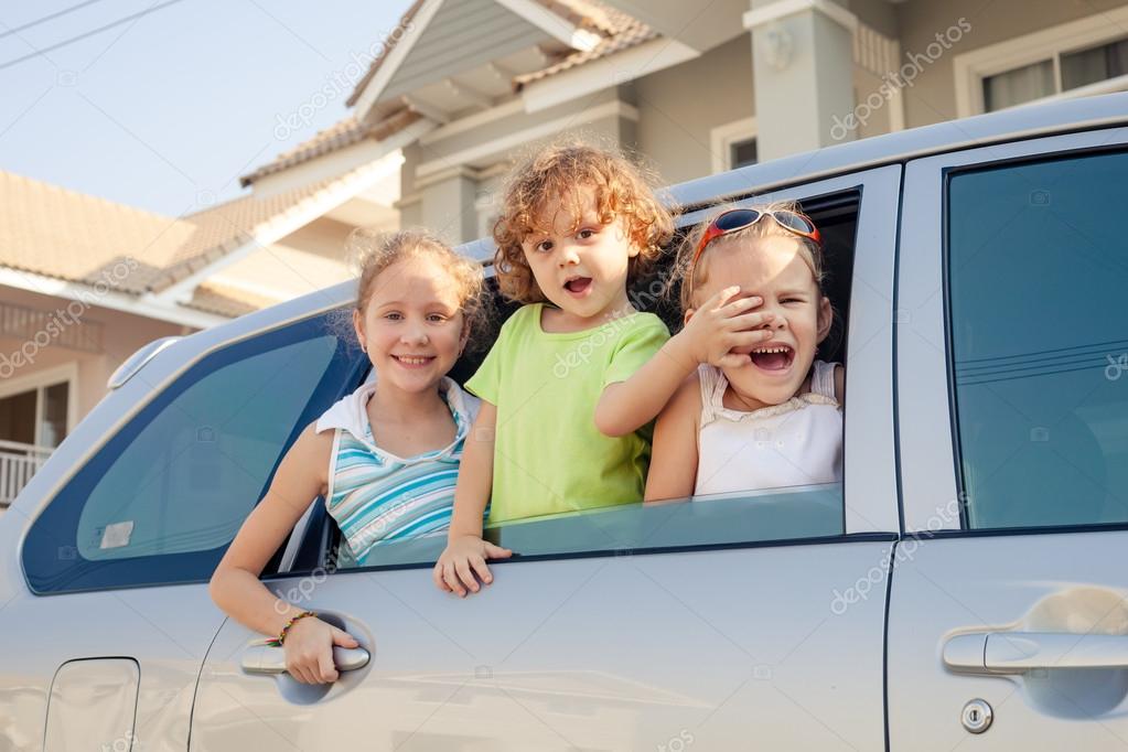 Three happy kids in the car Stock Photo by ©altanaka 43756565