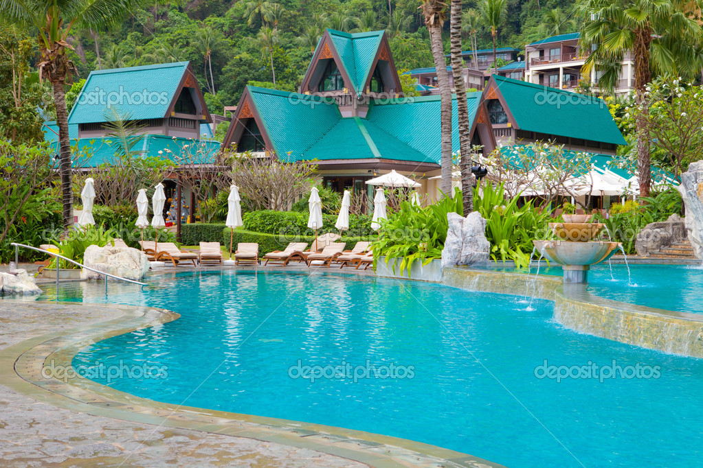 Swimming pool on the beach — Stock Photo © WitthayaP #12441047