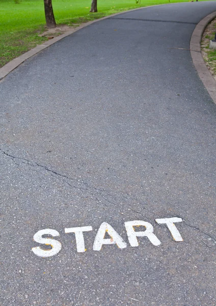 Asphalt road with white start sign — Stock Photo © ronstik #33268221