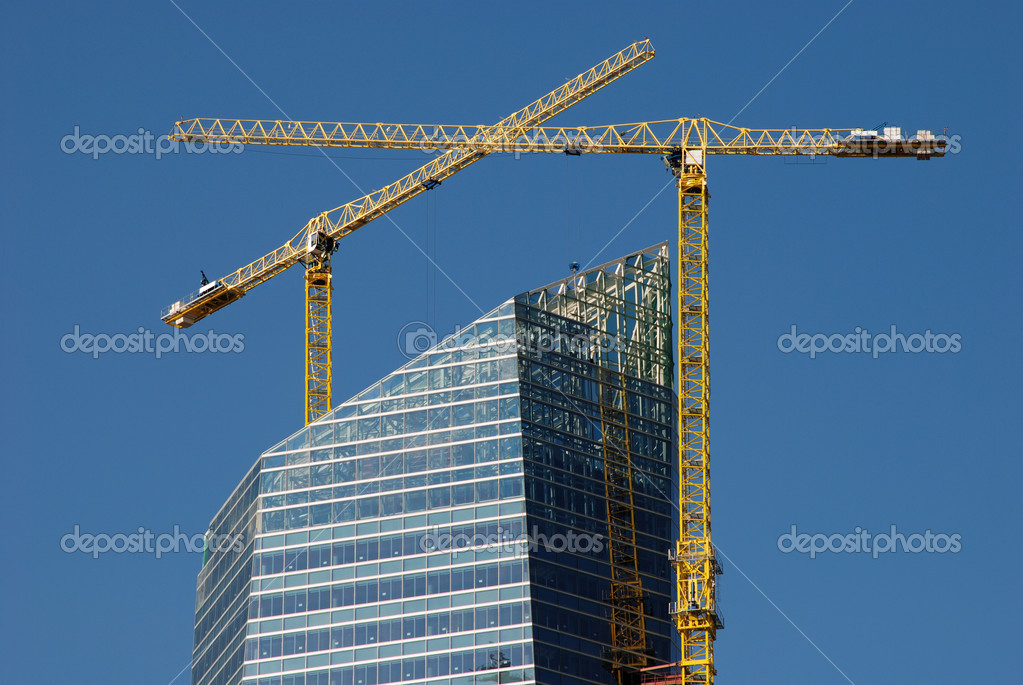 Skyscraper construction site with two tall cranes — Stock Photo ...