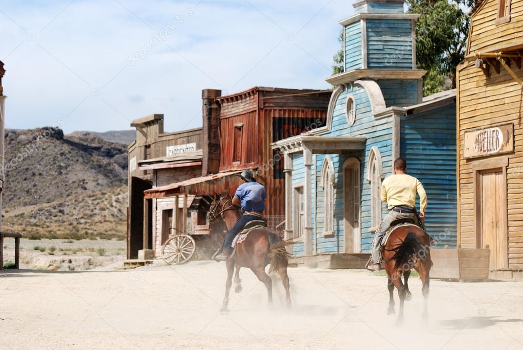 Two cowboys in a traditional American western town — Stock Photo ...
