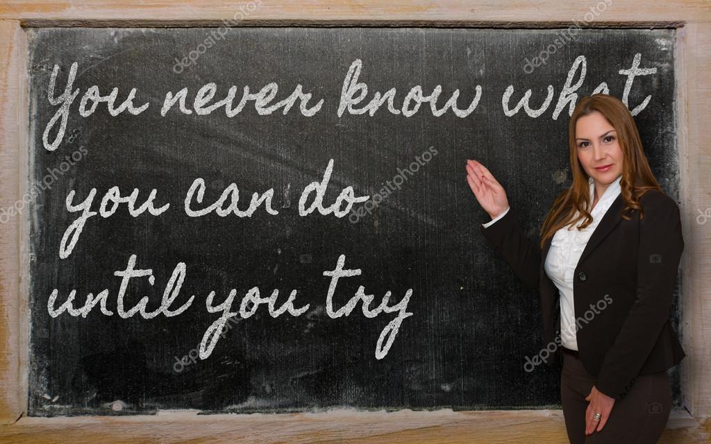 Teacher showing You never know what you can do until you try on — Stock ...