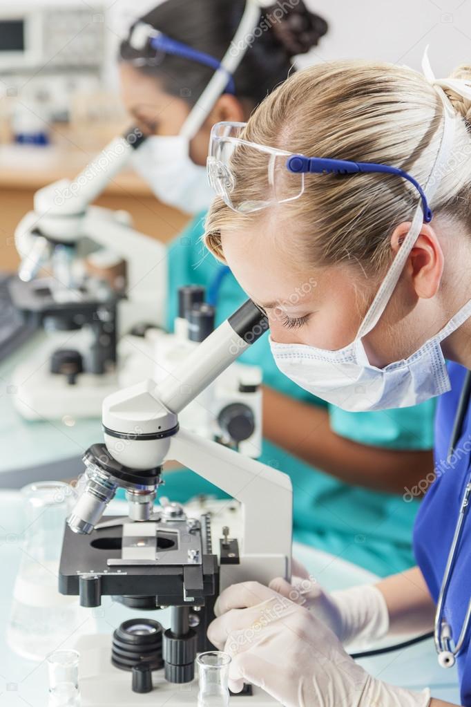 Female Scientist Research Team Using Microscopes in Laboratory — Stock ...