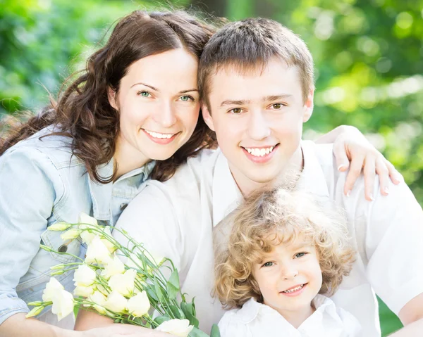Happy family with spring flowers - Stock Image - Everypixel