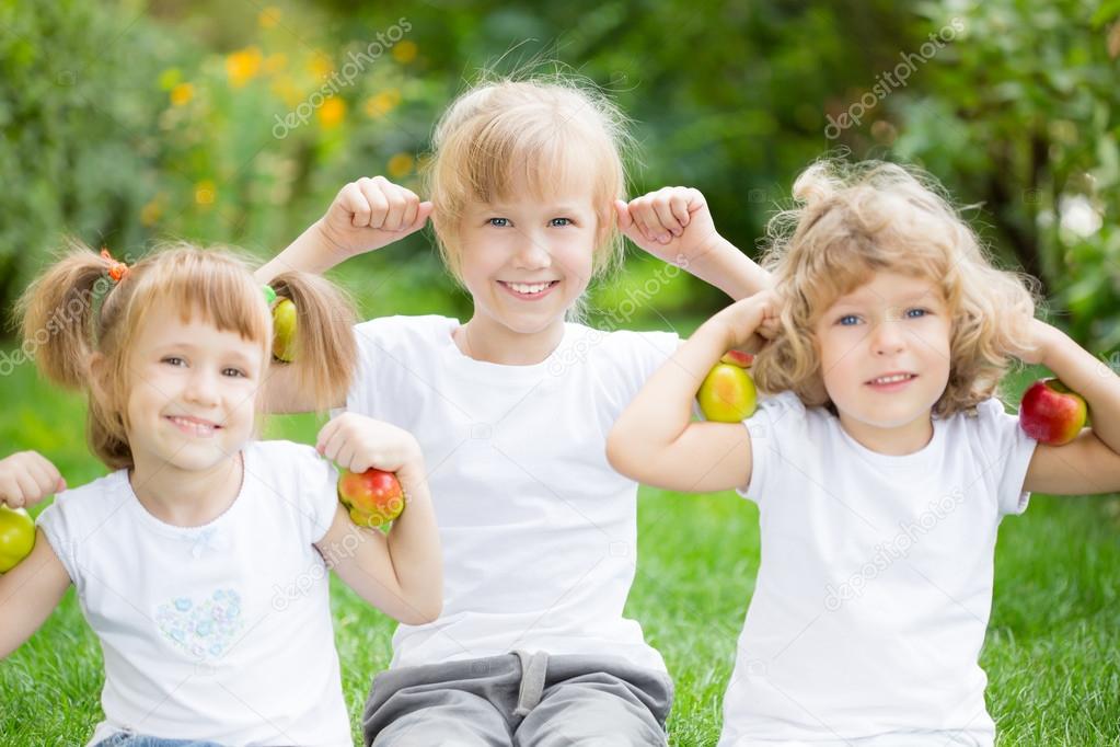 Happy active kids with apples Stock Photo by ©Yaruta 22150083