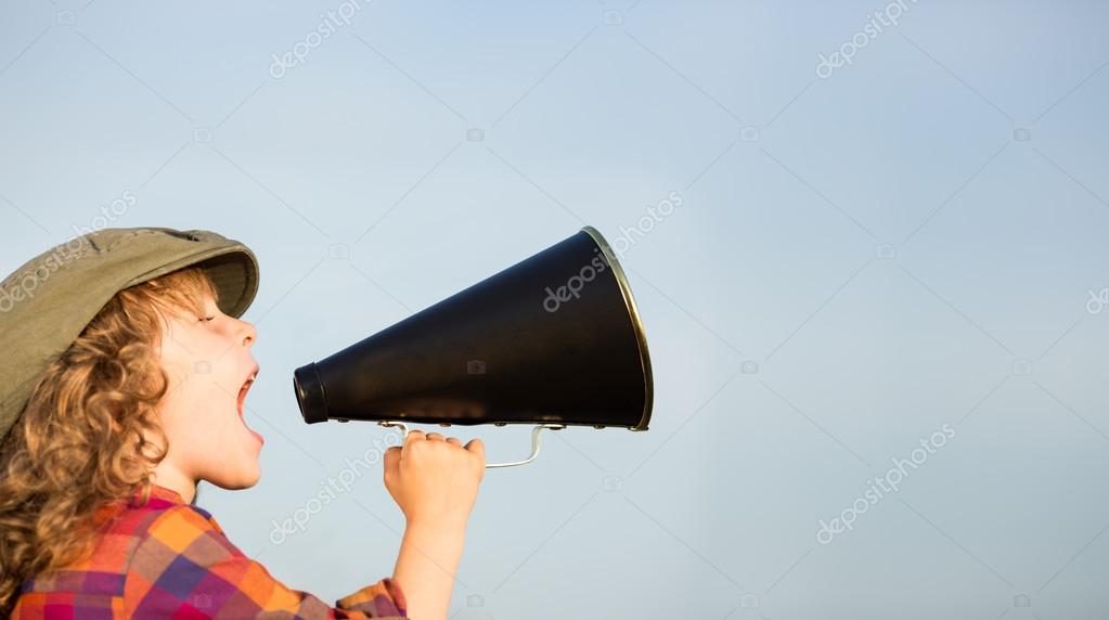 Kid shouting through megaphone Stock Photo by ©Yaruta 26160981