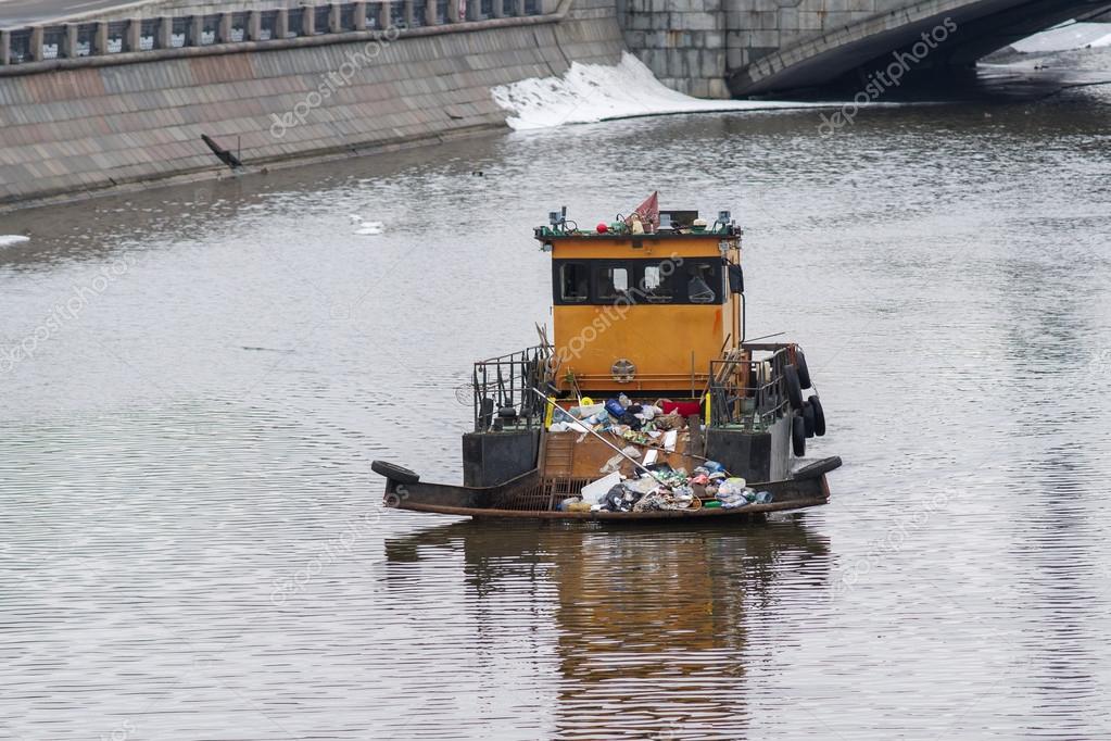 Garbage collector vessel going along the river — Stock Photo ...