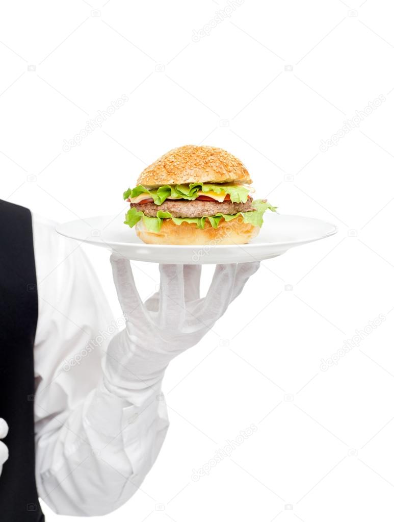 Waiter hand in white gloves holding hamburger on plate Stock Photo by ...