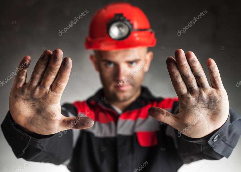 Coal miner making stop gesture Stock Photo by ©Gladkov 39094859
