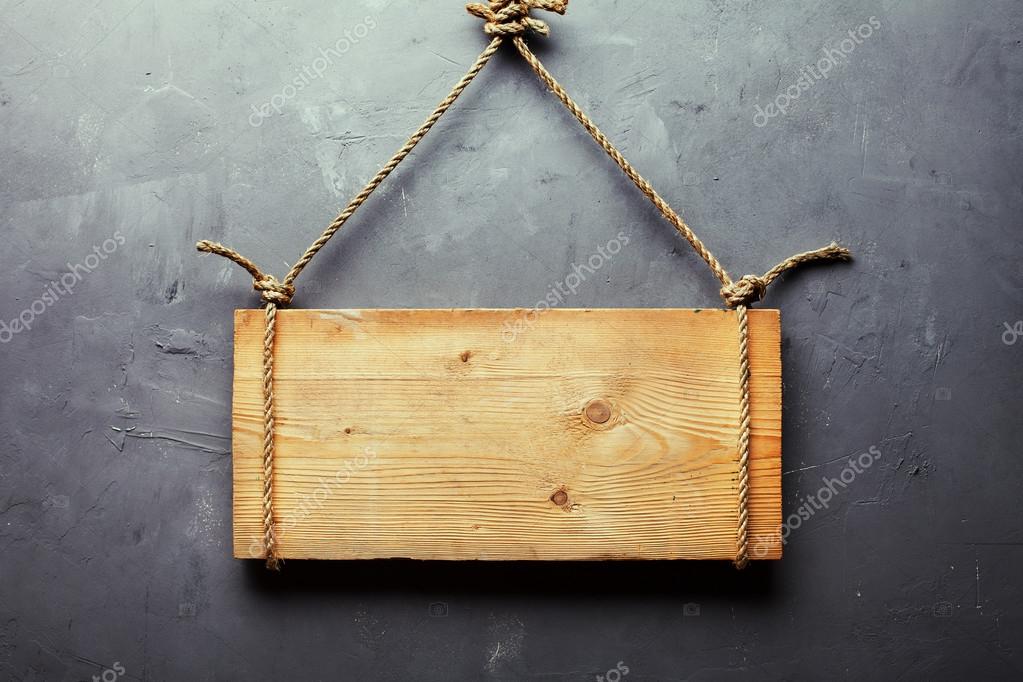 Wooden signboard hanging on rope — Stock Photo © Gladkov #39095047