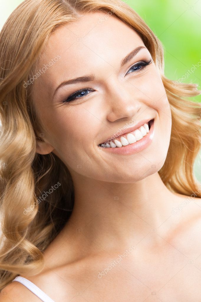 Happy smiling woman with long hair, outdoors — Stock Photo © g_studio ...