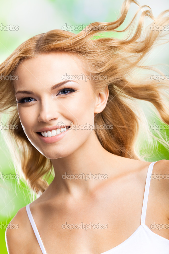 Happy smiling woman with long hair, outdoors — Stock Photo © g_studio ...