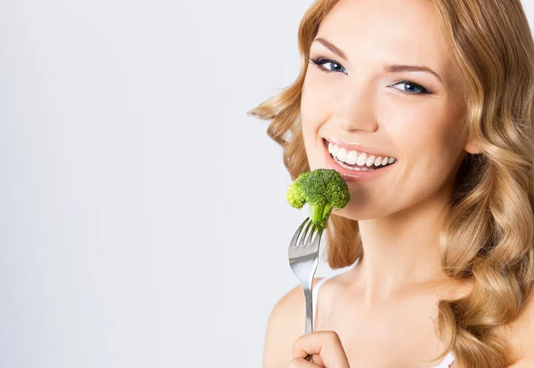Woman eating broccoli Stock Photos, Royalty Free Woman eating broccoli ...