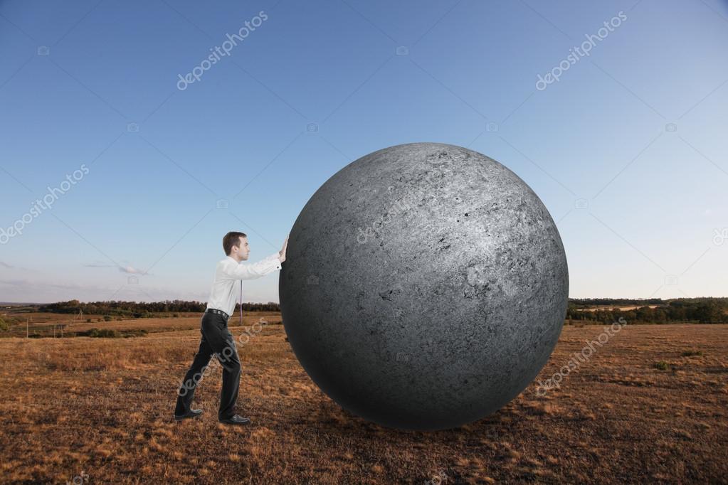 Man pushing ball Stock Photo by ©peshkova 21692127