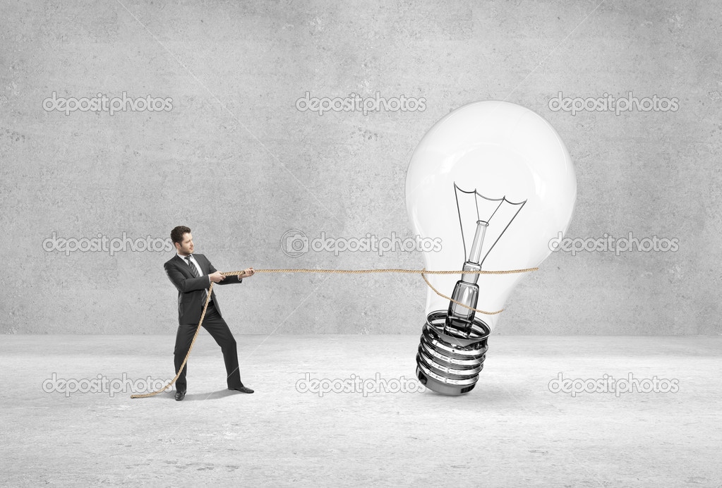 Man pulling lamp Stock Photo by ©peshkova 23654619
