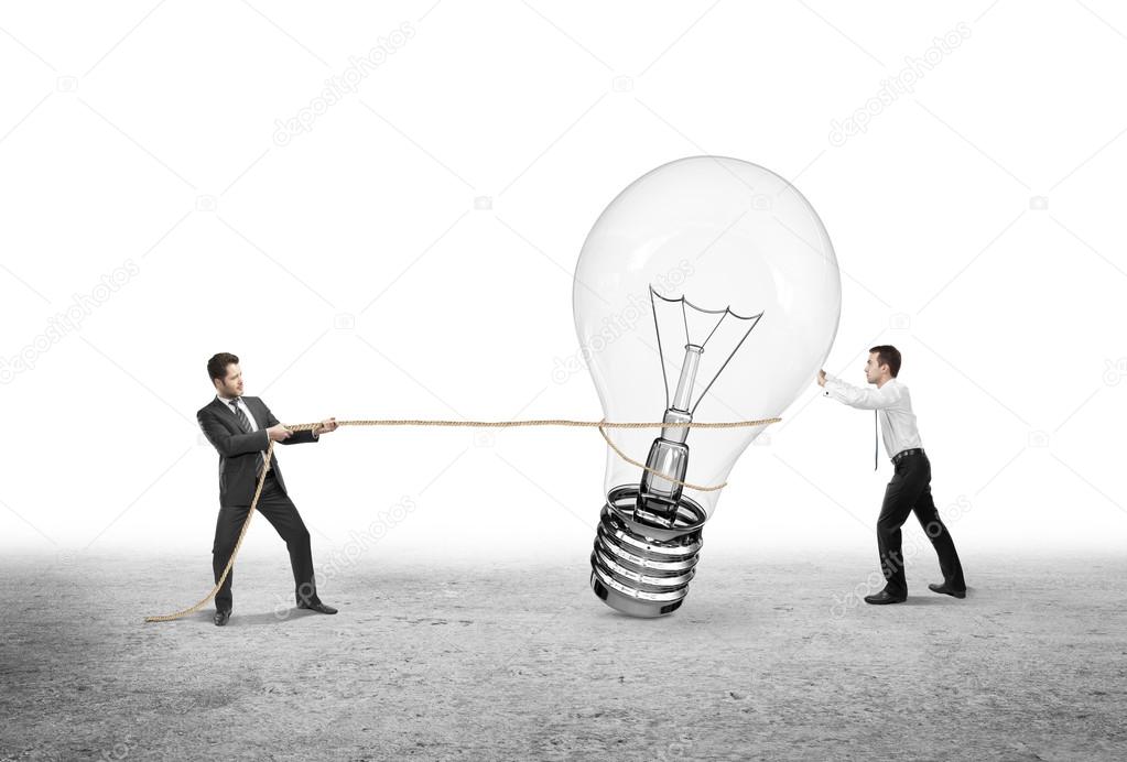 Two man pulling lamp Stock Photo by ©peshkova 23654691