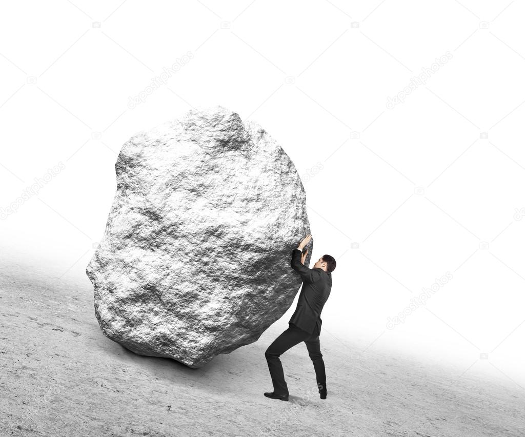 Man pushing stone — Stock Photo © peshkova #23989515 Man pushing stone — Stock Photo © peshkova #23989515