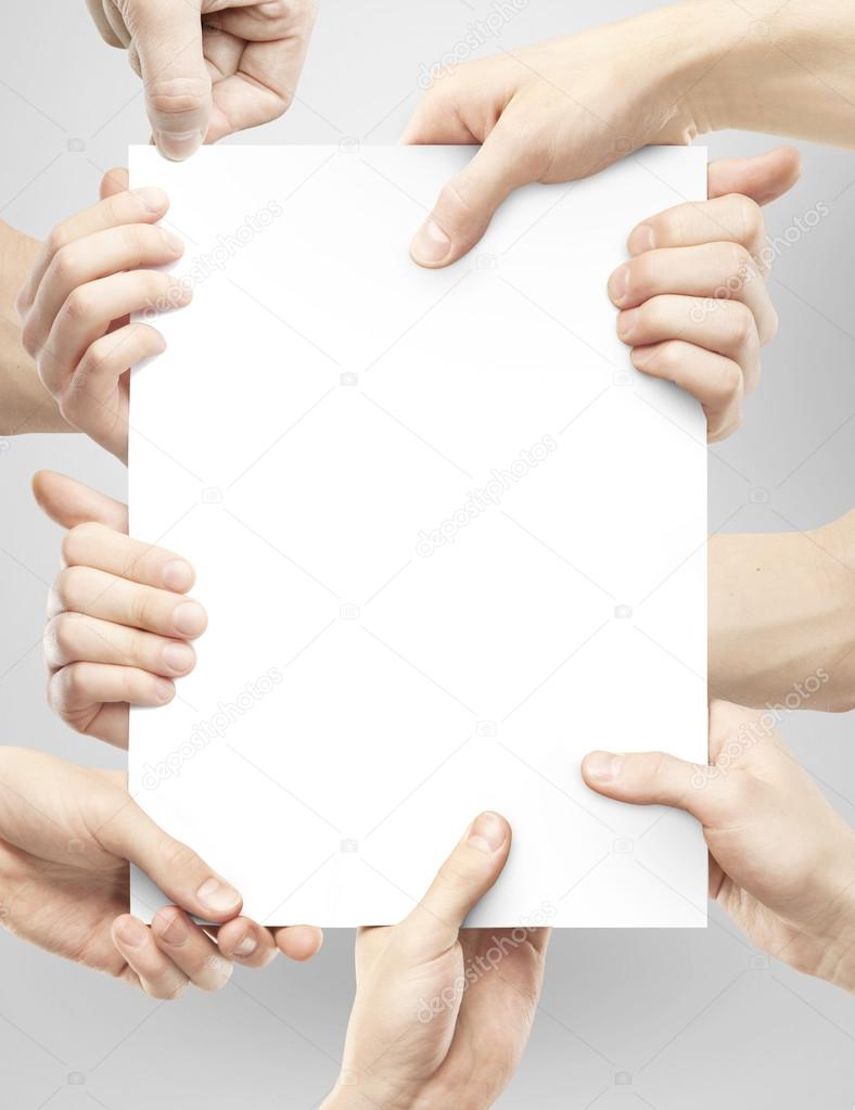 Many hands holding paper Stock Photo by ©peshkova 25033203