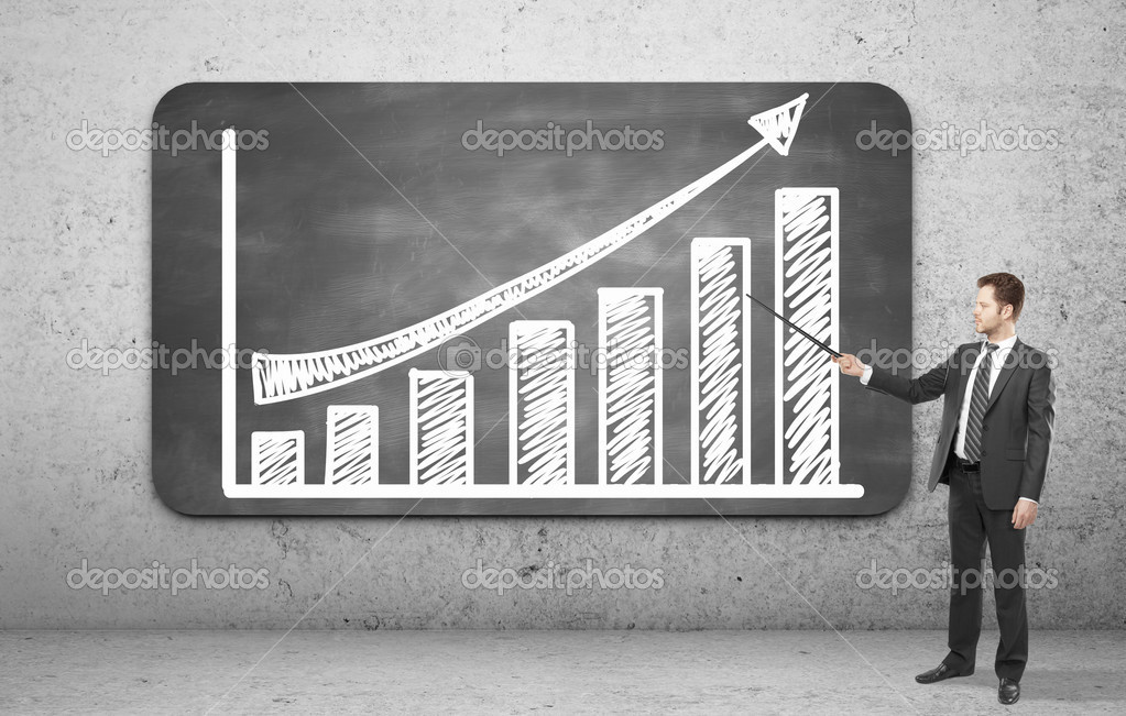 Man pointing on a graph Stock Photo by ©peshkova 25033309