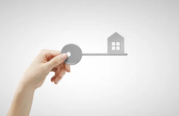 Hand holding key house Stock Photo by ©peshkova 33671159