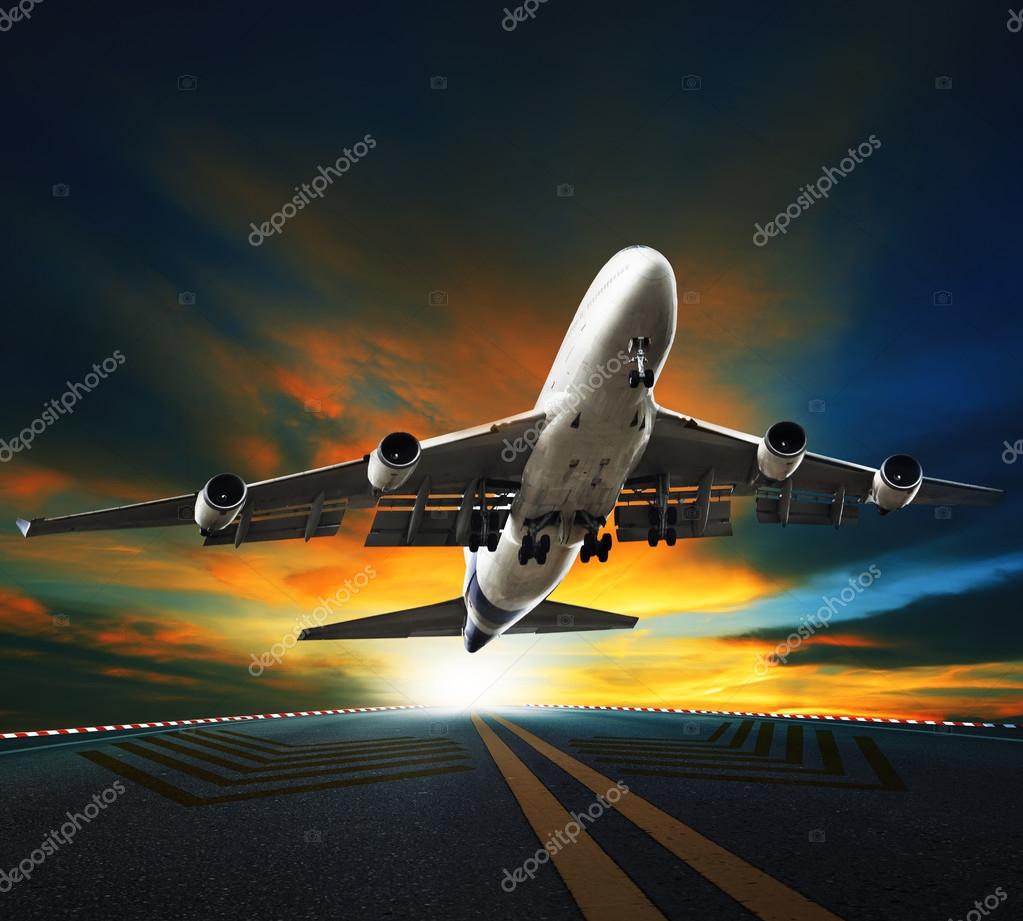 Passenger plane take off from runways against beautiful dusky sk ...