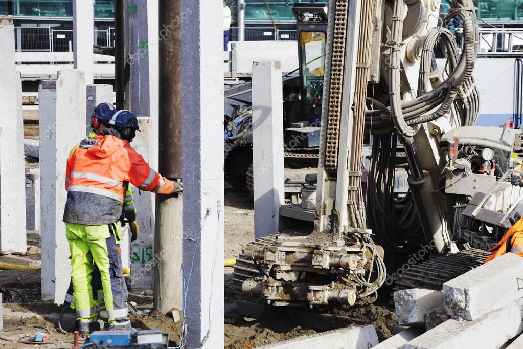 Building workers and heavy machinery Stock Photo by ©lagereek 32645779