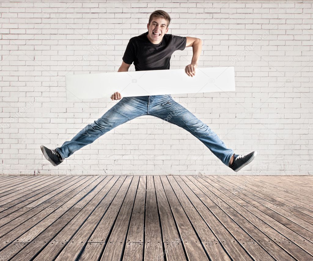 Young man jumping Stock Photo by ©xavigm99 40347293