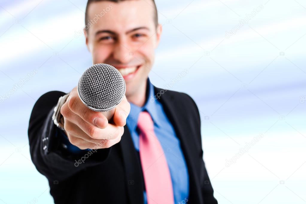 Man holding a microphone Stock Photo by ©minervastock 24036377