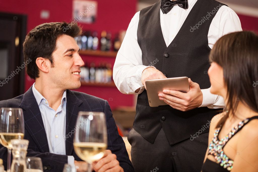 Waiter using a digital tablet — Stock Photo © minervastock #32801885