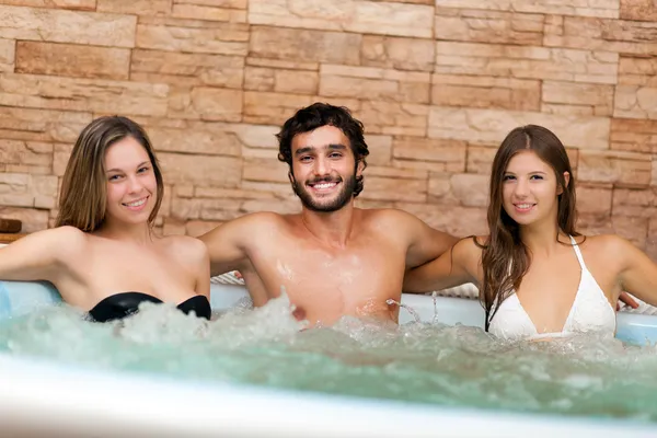 2 girls one guy in the hot tub images libres de droit, photos de 2 girls one guy in the hot tub ...