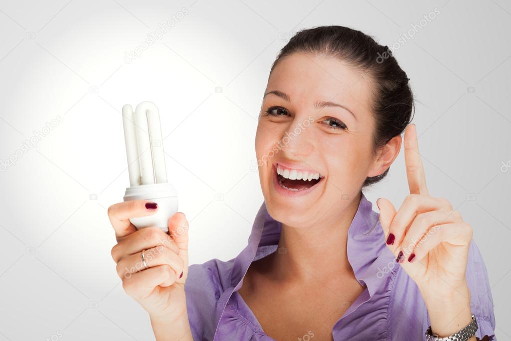 Woman holding a lamp Stock Photo by ©minervastock 40517735