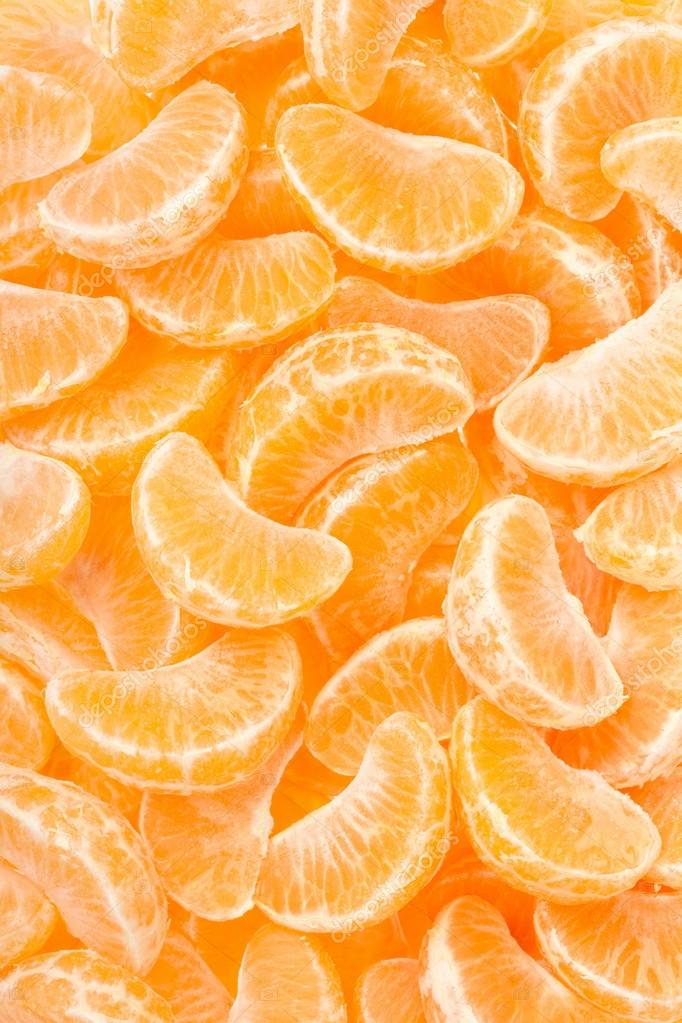 Tangerine, orange segments background texture — Stock Photo © AndreaA ...