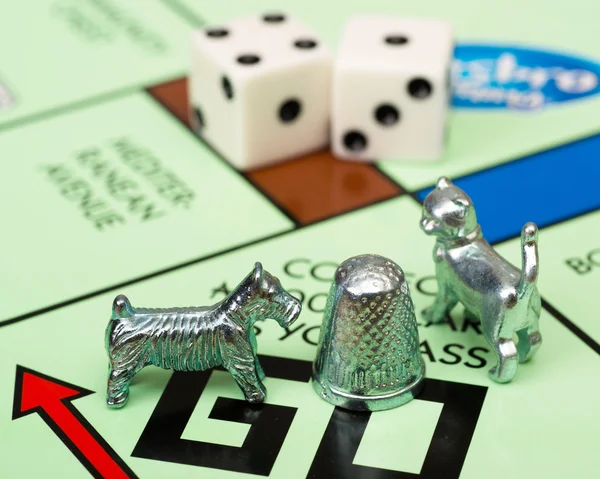 Macro image of Monopoly Game and Figures – Stock Editorial Photo ...