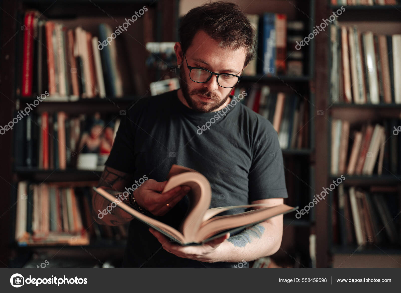 Adult student reading a book in the college library — Stock Photo ...