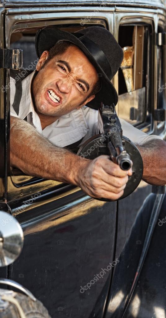 Angry Gangster Shooting Gun — Stock Photo © creatista #39258237