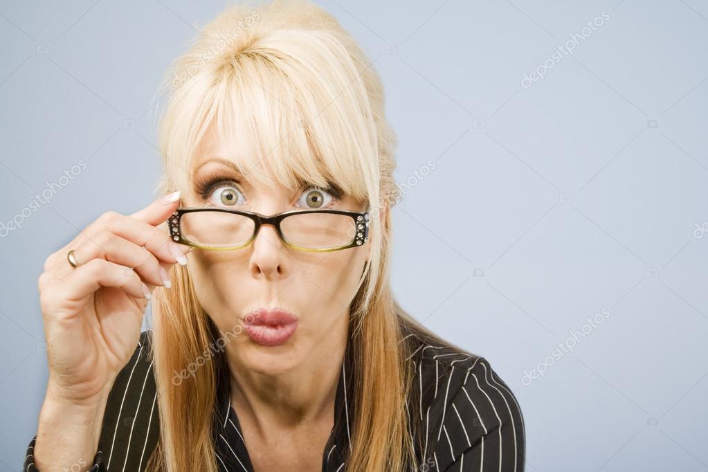 Woman Looking Over Her Glasses Stock Photo by ©creatista 39606795