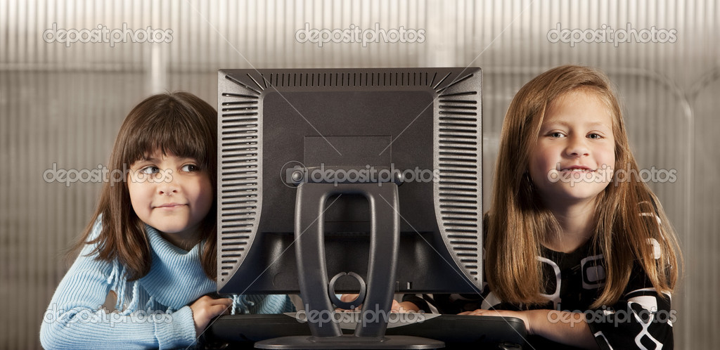 Two girls and a computer Stock Photo by ©creatista 39760121
